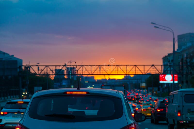 Traffic Jam on the Road in the Evening at Sunset in Summer. Red Lights ...