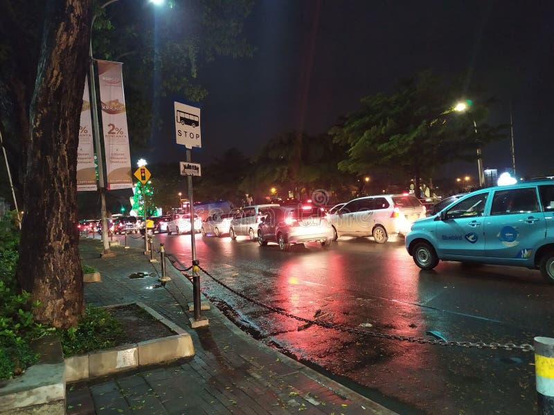 Traffic Jammed Light Intersection at Night after Rain in Indonesia ...