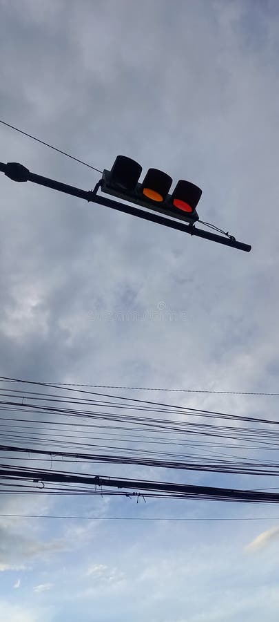 A Traffic Lamp and a Lines of Electricity String in the Sky Stock Photo ...