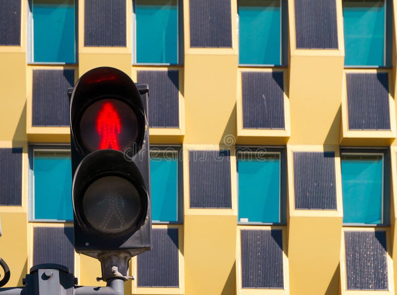 A Traffic Light in Front of a Building Stock Photo - Image of crossing ...