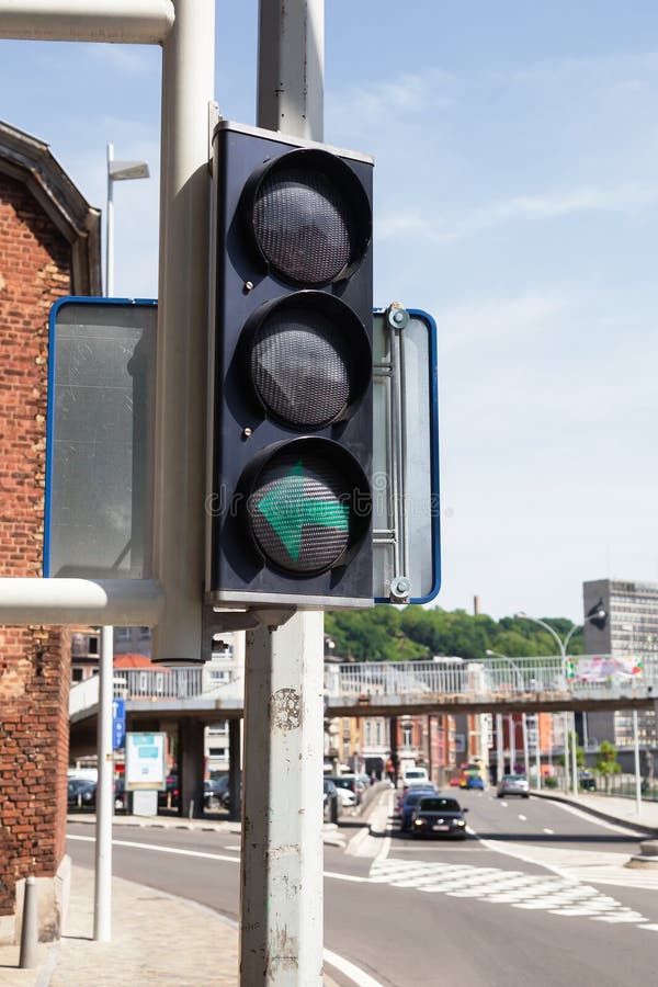 Traffic Light with a Green Direction Arrow in a City Stock Image ...