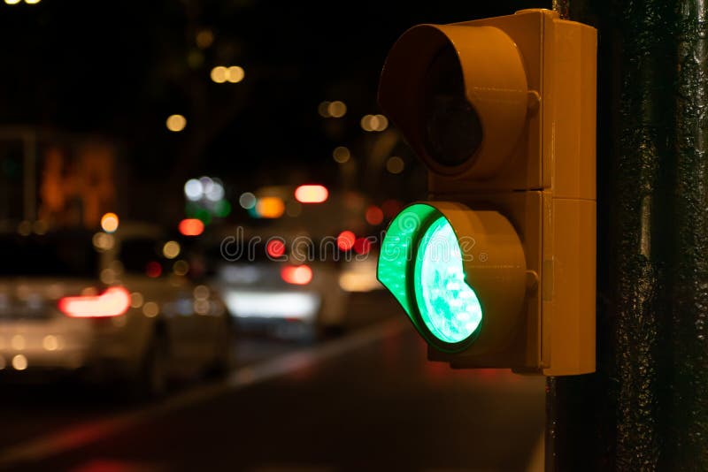 Traffic Light with a Green Light on at Night Stock Image - Image of ...