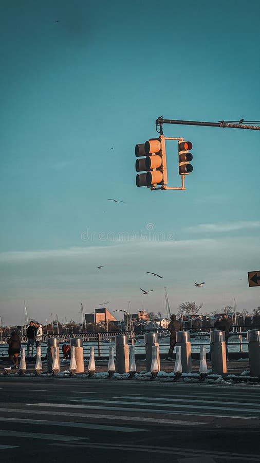 Traffic Light Hanging Over an Empty Intersection at Sunset Stock Photo ...