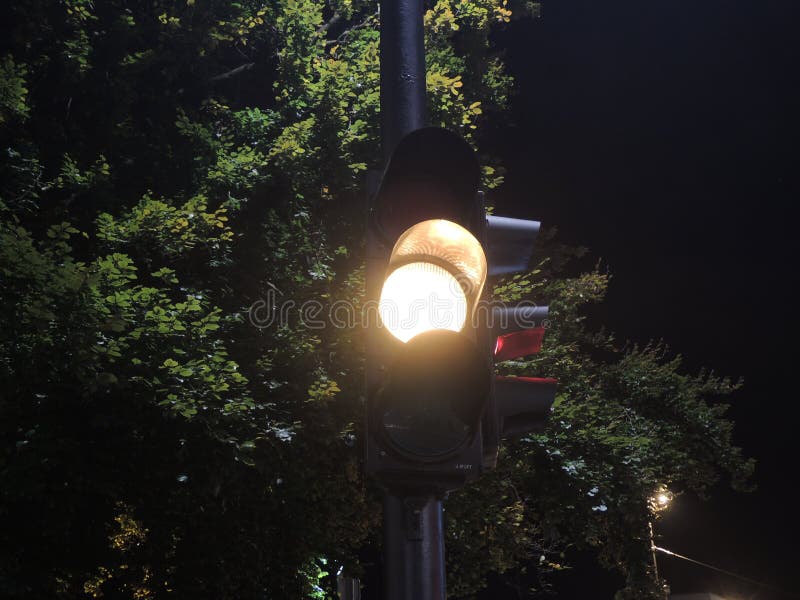 Traffic Light at Night-time Showing Yellow Stock Photo - Image of light ...