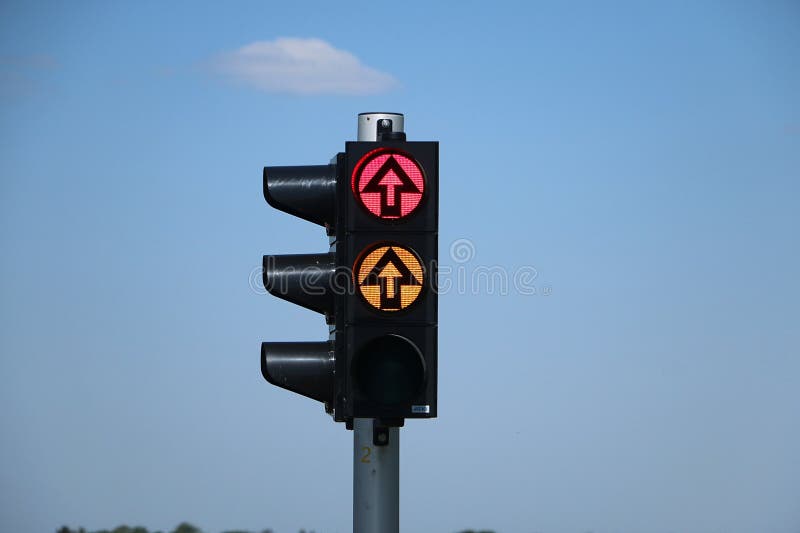 A Traffic Light with Red and Yellow Lights Simultaneously and Arrows on ...