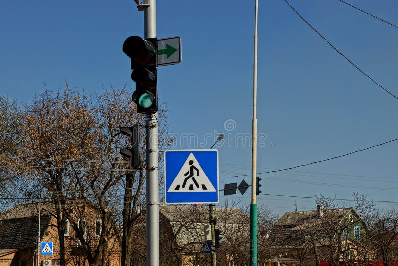 Traffic Light and Road Sign at the Intersection Stock Image - Image of ...