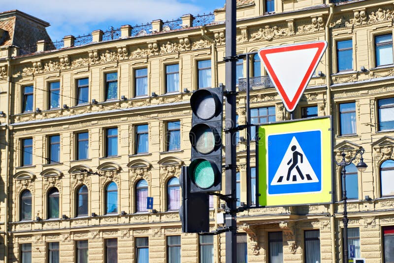 Traffic Light And Road Signs On Old City Building Stock Photo - Image ...