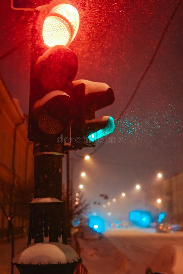 Traffic Light on a Snowy Night Stock Photo - Image of road, evening ...