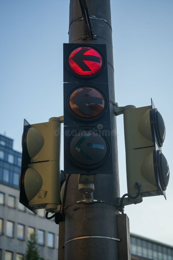 Traffic Lights with Arrow on Vertical Pole Stock Photo - Image of ...