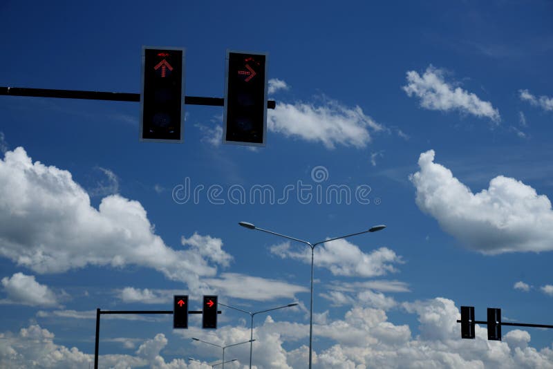 Traffic Lights on an Intersection in Thailand on a Blue Sky Background ...