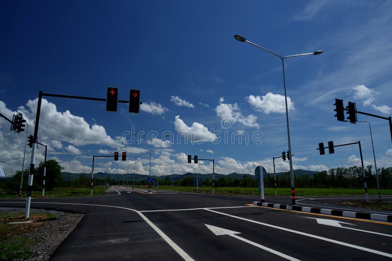 Traffic Lights on an Intersection in Thailand on a Blue Sky Background ...