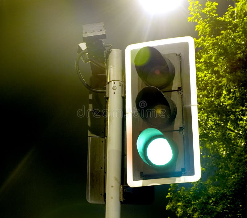 Traffic Lights Near a Bright Lamp at Night Stock Image - Image of stop ...