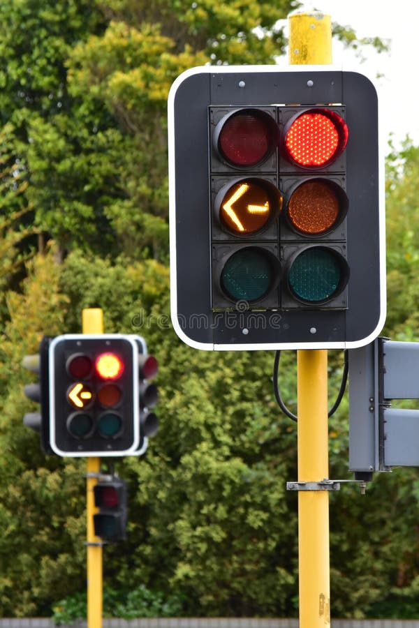 Traffic Lights on Yellow Poles Stock Image - Image of lights, traffic ...