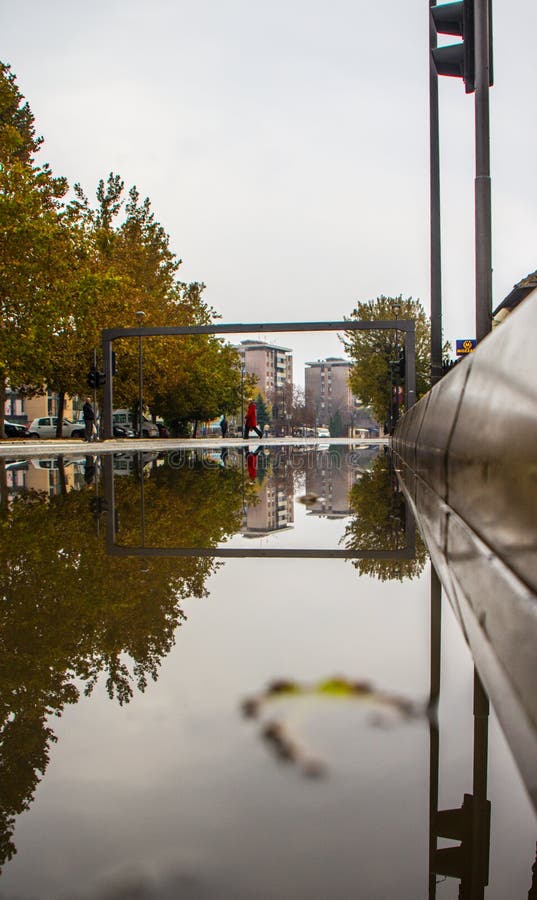 Traffic Reflection in Street Puddle of Water Stock Image - Image of ...