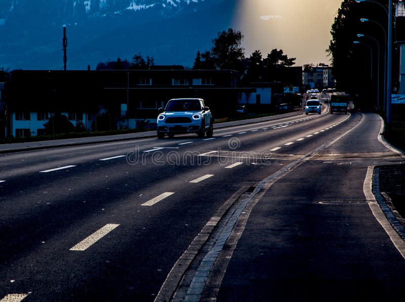 Traffic on a Road in Dim Light Stock Photo - Image of caffeine, rain ...