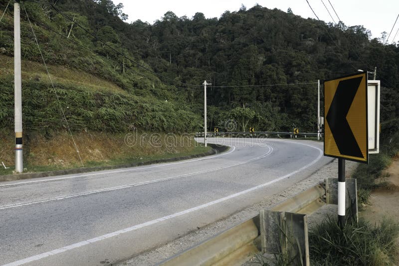 Traffic Road Sign Warning a Sharp Bend in Front on an Empty Street ...