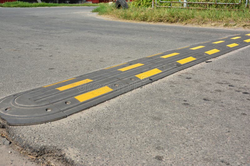 Traffic Safety Speed Bump On An Asphalt Road. Speed Bumps Or Speed ...