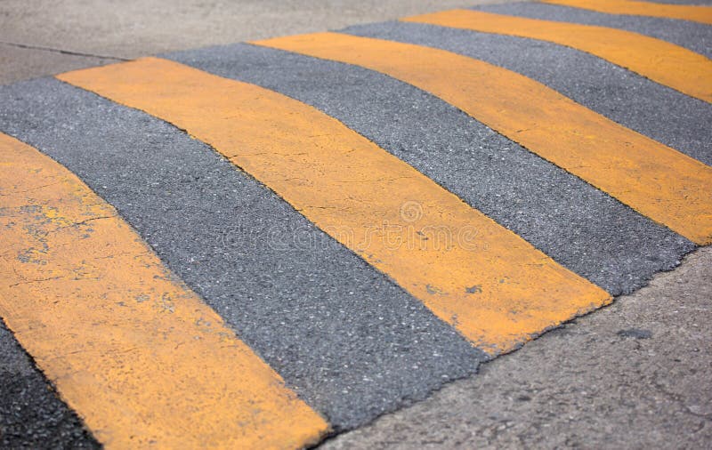 Speed Bump On A Concrete Road Stock Photo - Image of outdoors, risk ...