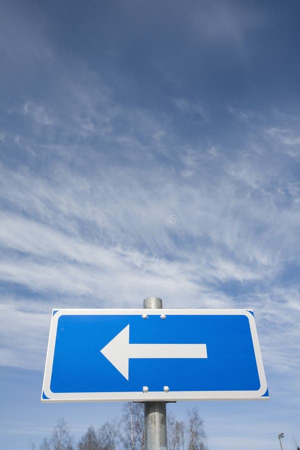 Traffic Sign Arrow Pointing Left Against Sky Stock Image - Image of ...