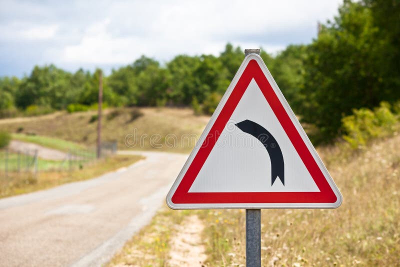 Traffic Sign Indicating Road is Turning Left Stock Photo - Image of ...