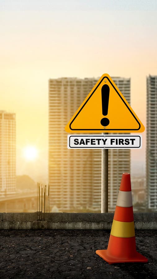 A Traffic Sign with Safety First Text and a Traffic Cone Stock Photo ...