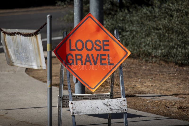 A Traffic Sign Stating Loose Gravel Stock Image - Image of caution ...