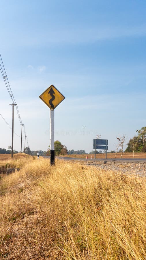 A Traffic Sign Warning of a Curve in the Countryside Stock Image ...