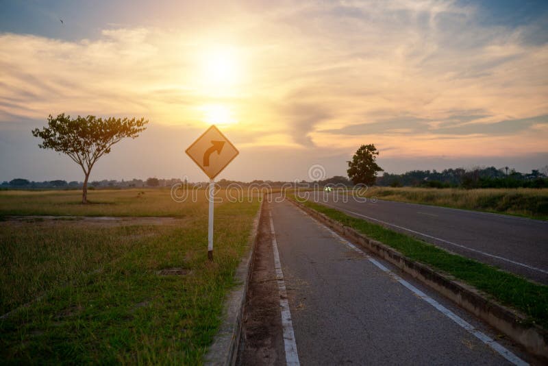 The Traffic Signs and Bike Paths during the Sunset Stock Photo - Image ...