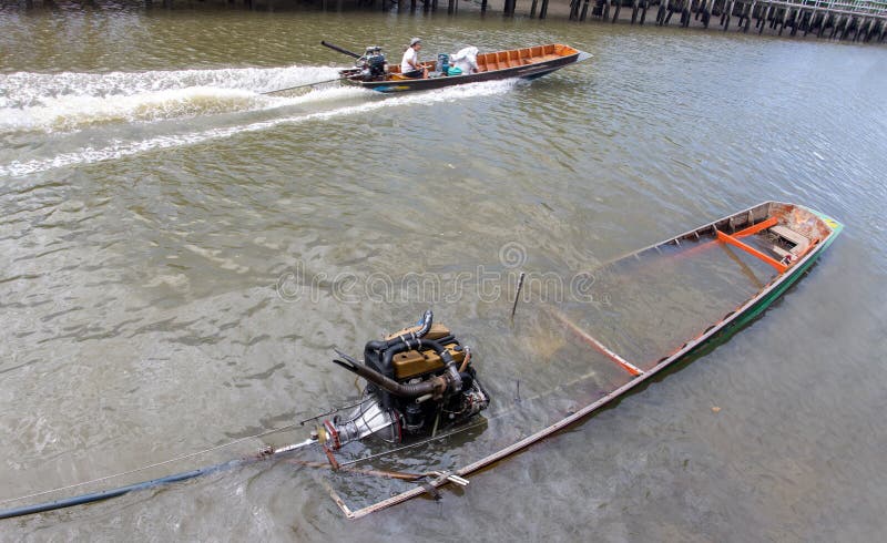 Traffic on a Water Canal with a Sinking Boat, Thailand Editorial Stock ...