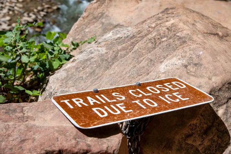 Trail Closed To To Ice Sign Fallen Down on the Rock Stock Image - Image ...