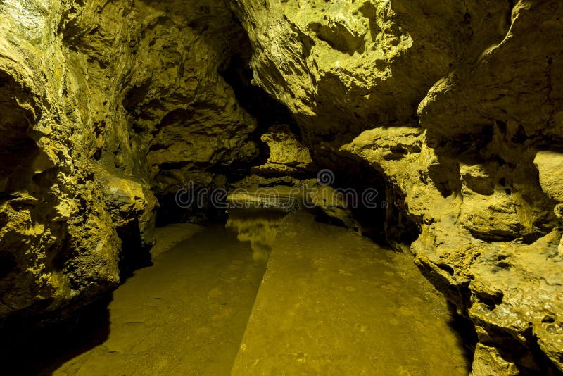 Path To Cave Exit stock photo. Image of cave, rock, green - 71990956