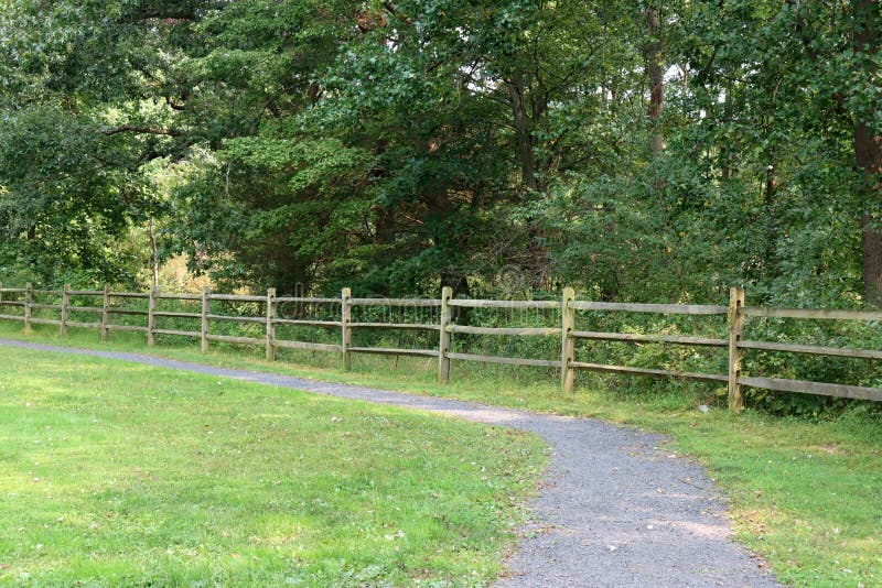 The Trail is Right by the Wooden Fence. Stock Photo - Image of ...
