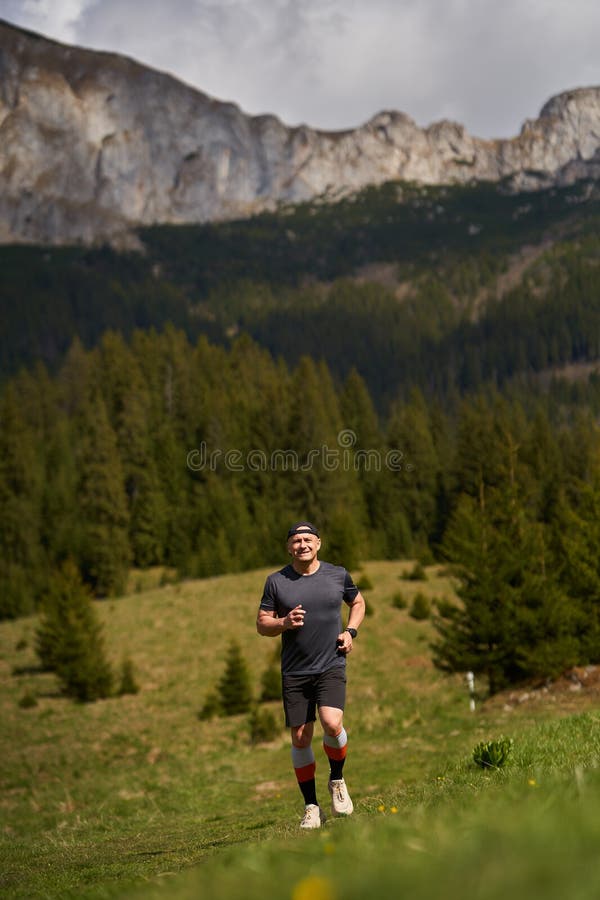 Trail runner man in a race stock image. Image of mountains - 317324717
