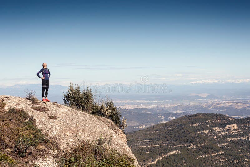 Trail Runner Standing and Taking a Break while Looking Landscape from ...