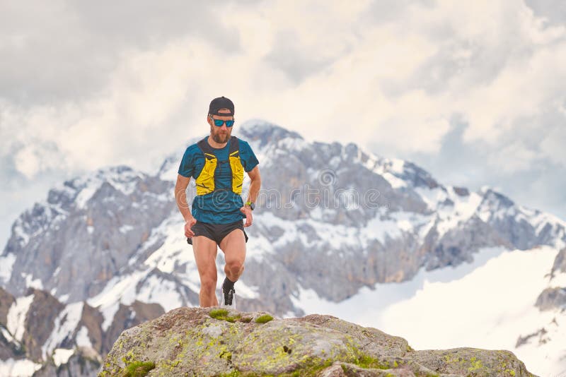 Trail Running Athlete in the Mountains on Rocks Stock Photo - Image of ...