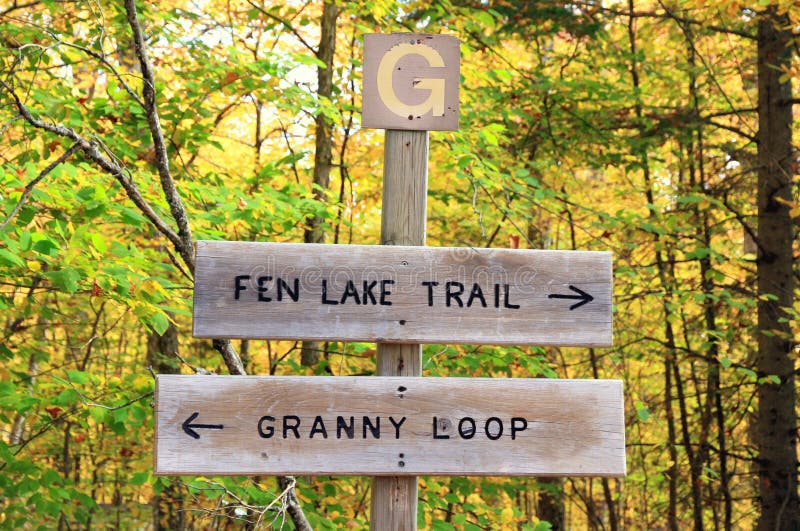 Trail Signs With White Straight Ahead Arrows On Posts Pointing Towards ...
