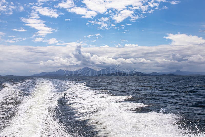 Trail of a Speedboat S Engine in the Water in the Foreground Stock ...