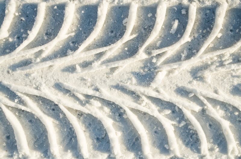 The Trail from the Tread of Car Wheel in the Snow Background. Stock ...