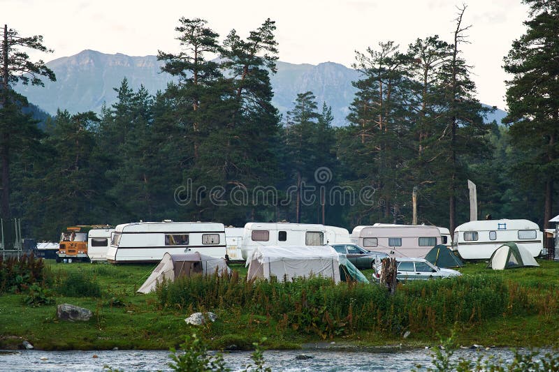 Trailer Camp at Green Valley in the Forest. Glade Full of Camper Vans ...