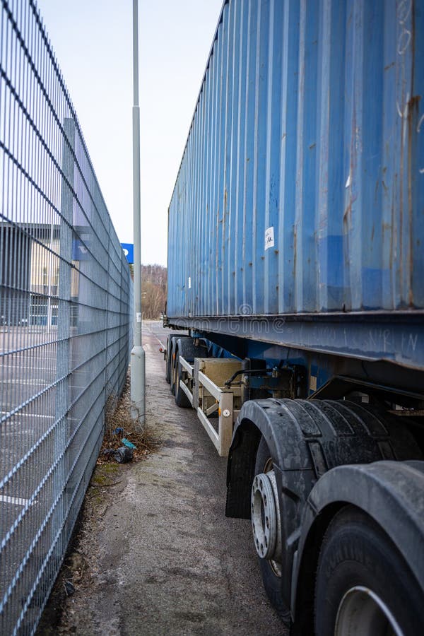 Trailer with Freight Container Parked Close To a Fence and Pole.. Stock ...