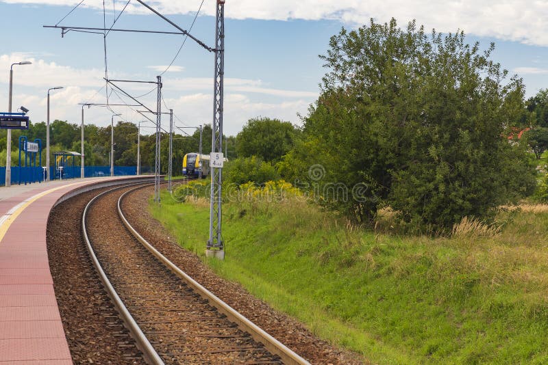 Train approaching station stock photo. Image of mover - 1527252