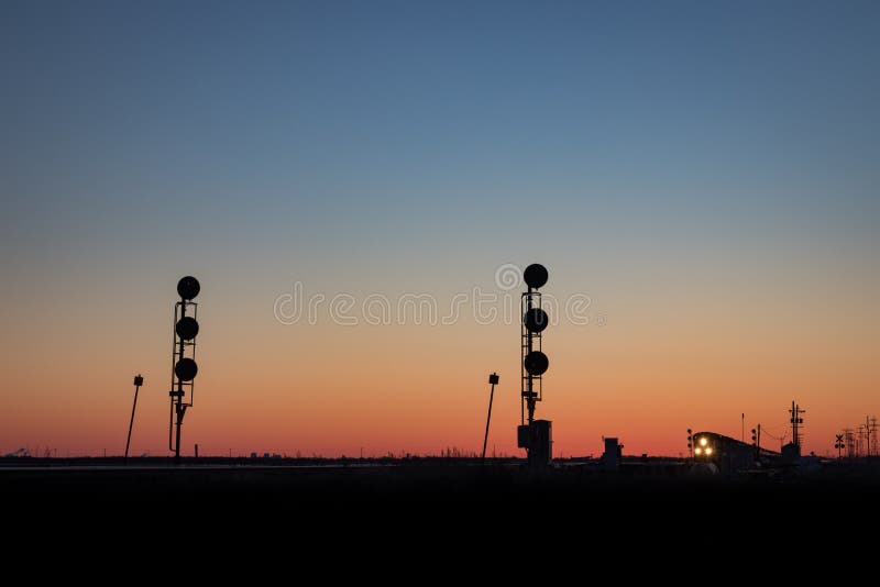 Train Approaching Railway Signals at Sunset on Canadian Prairie Stock ...