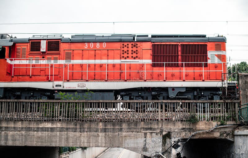 There is a Train Coming Down the Tracks Under the Bridge Editorial ...