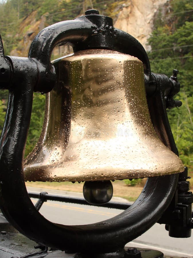 Train Bell in the Rain stock photo. Image of lights, hanging - 6058938
