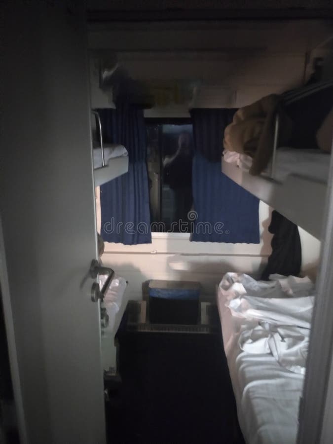 Train Cabin with Bunk Beds, Curtains, and Window in a Sleeper ...