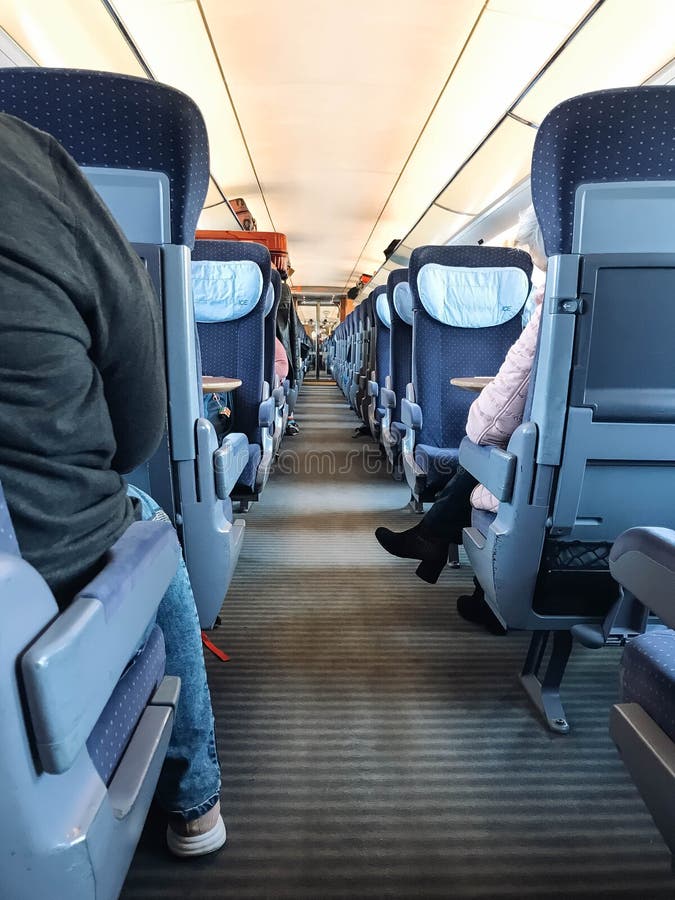 A Train Car with People Sitting in it Stock Image - Image of crew ...
