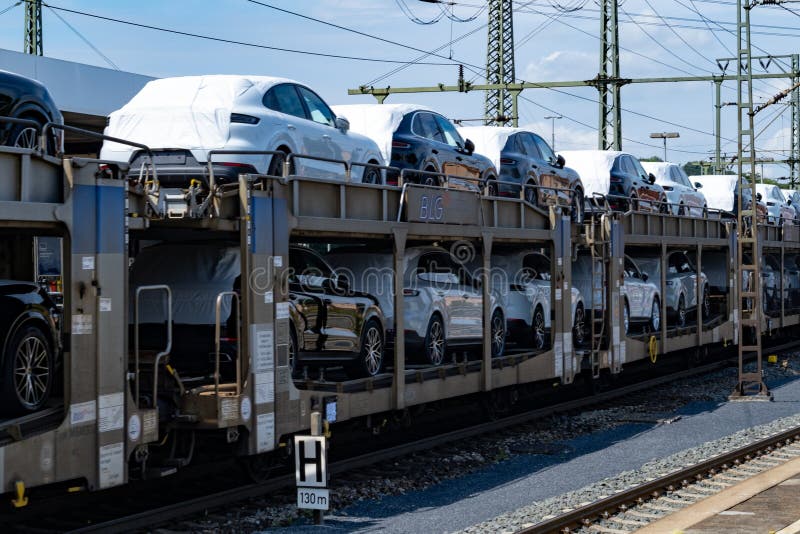 Train Carrying Multiple New Porsche Macan SUVs, Some Covered and Some ...