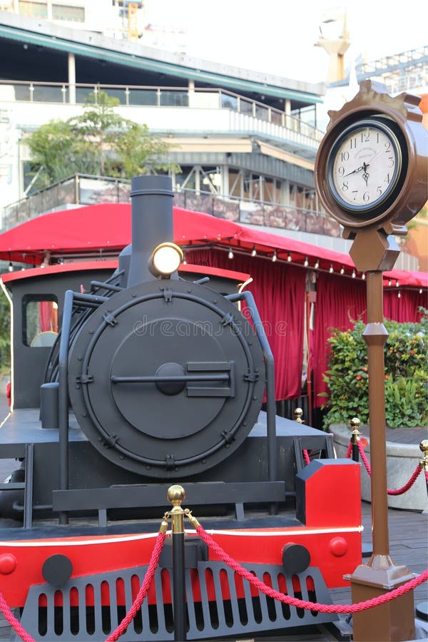 A Train with a Clock on the Side of it Stock Image - Image of ...