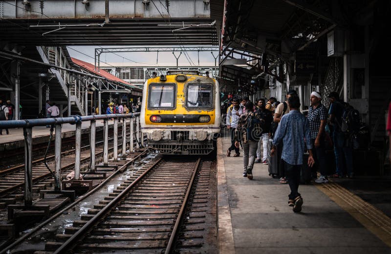 A Train is Coming To a Stop on the Platform of the Railway Junction ...