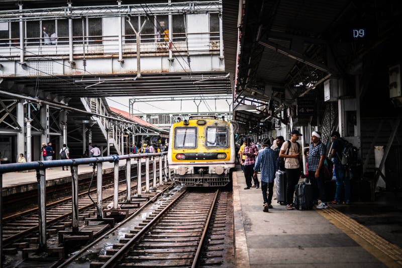 A Train is Coming To a Stop on the Platform of the Railway Junction ...